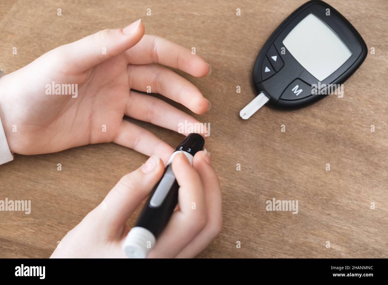 Diabetes checking blood sugar level. Child using lancelet and ...