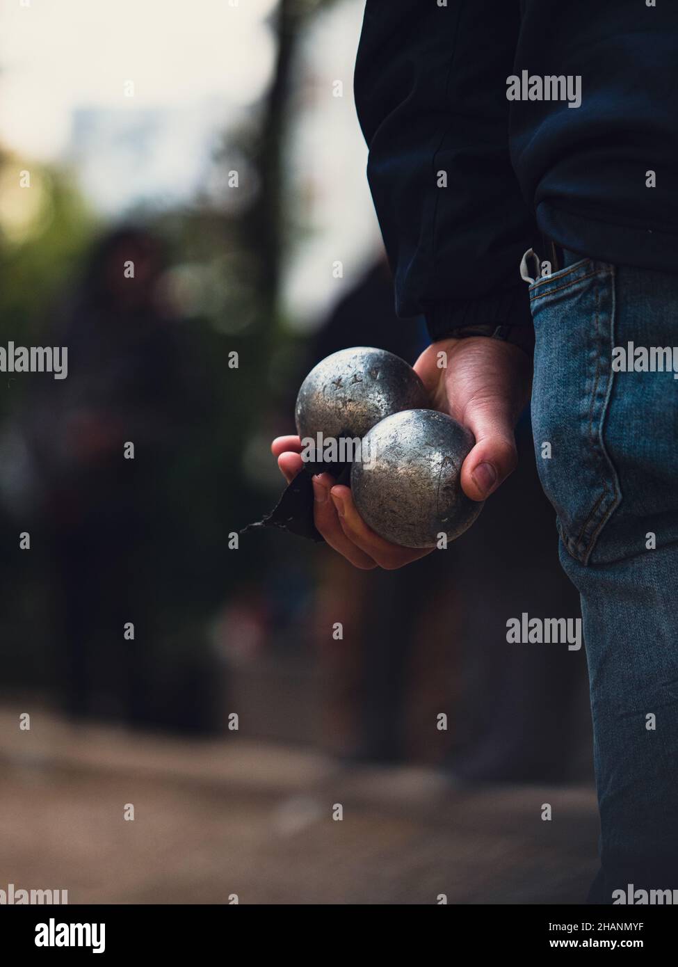 Two balls man hand hi-res stock photography and images - Alamy