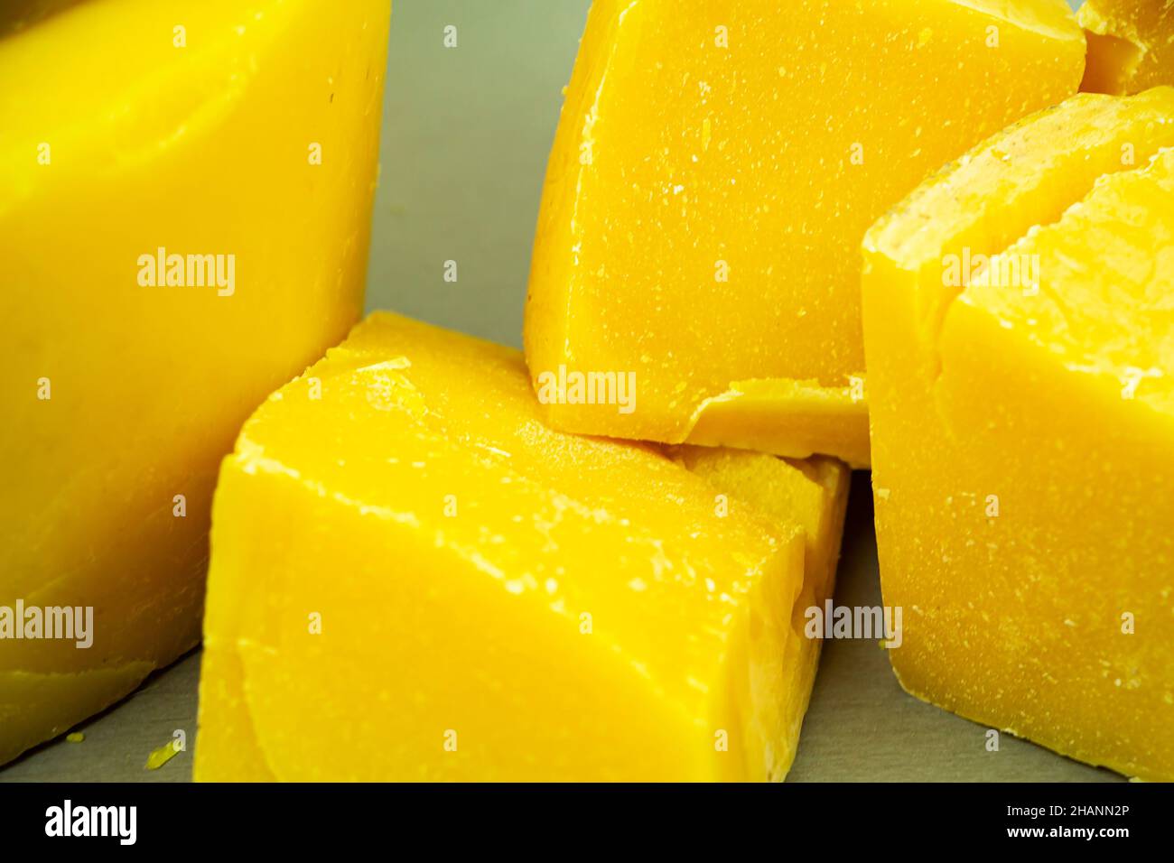 large pieces of natural beeswax, close-up, raw materials for candles ...