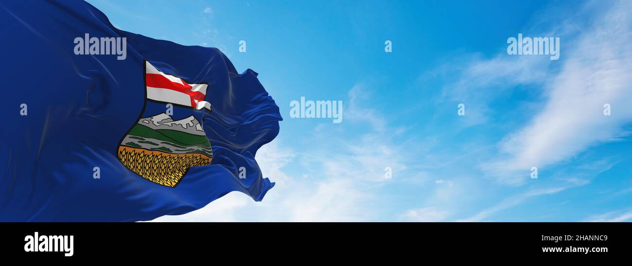 flag of Alberta , Canada at cloudy sky background on sunset, panoramic ...
