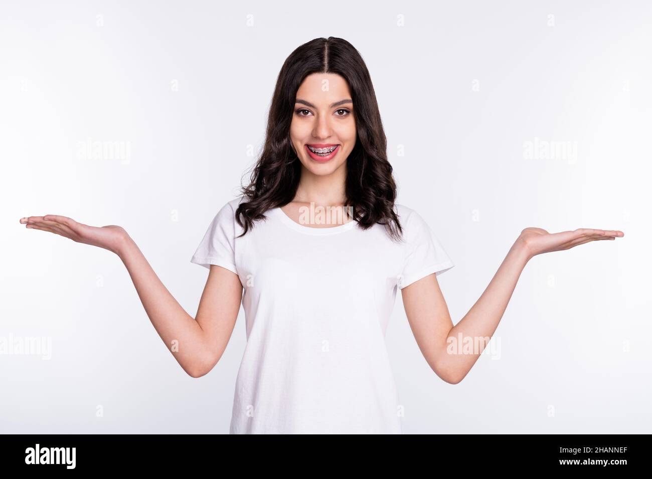 Photo of pretty adorable young lady wear casual outfit smiling compare ...