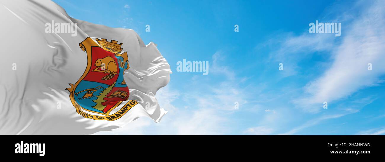 flag of Brampton , Canada at cloudy sky background on sunset, panoramic ...