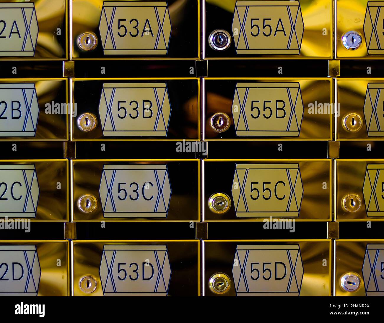 Closeup of the golden lockers with numbers Stock Photo - Alamy