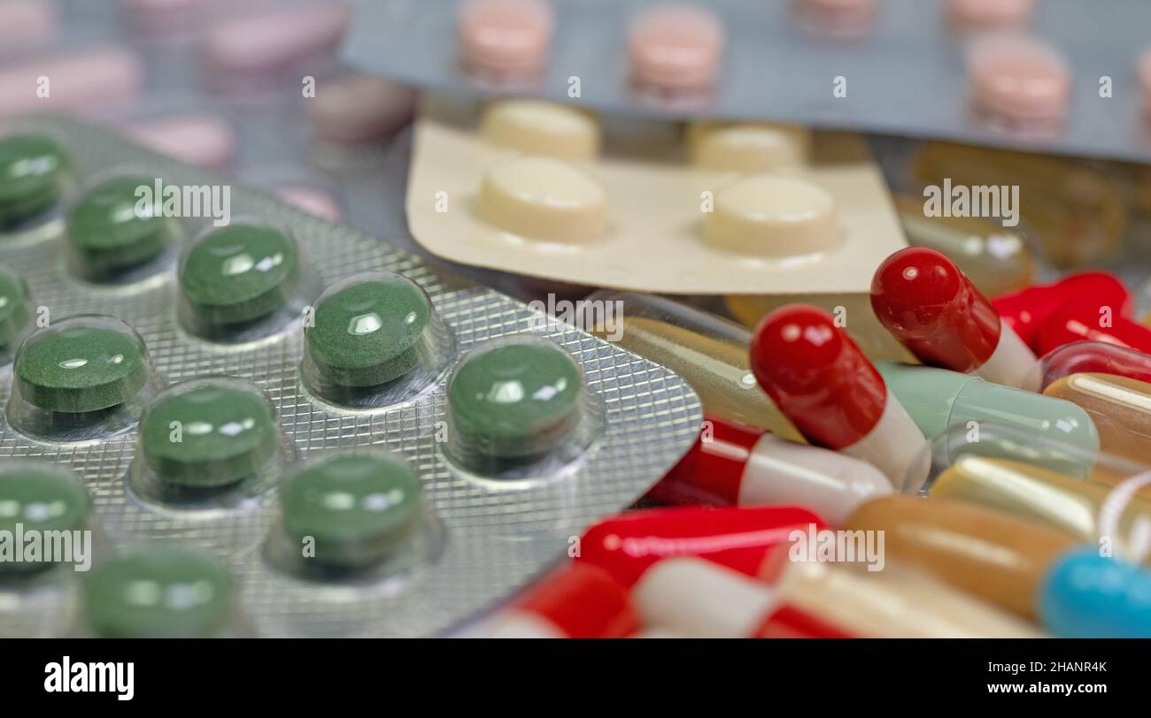 Lots of colorful capsules and tablets in a close-up Stock Photo - Alamy