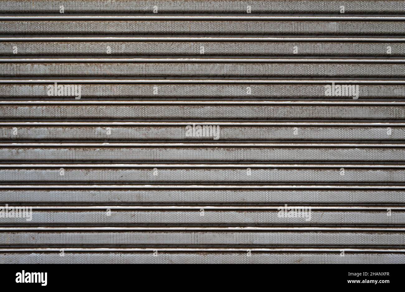 Perforated metallic surface texture background Stock Photo - Alamy