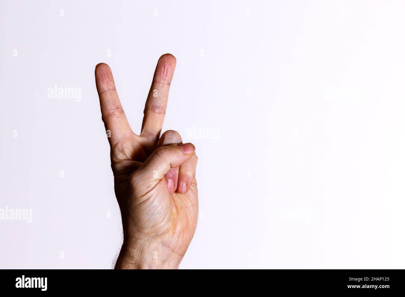 A hand with 2 finger Stock Photo - Alamy