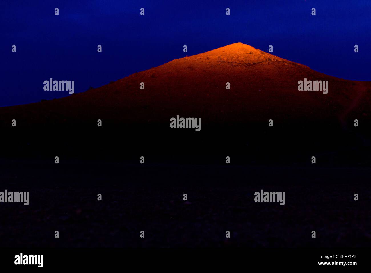 Peak illuminated by the light from Darvaza Derweze gas crater Door to ...