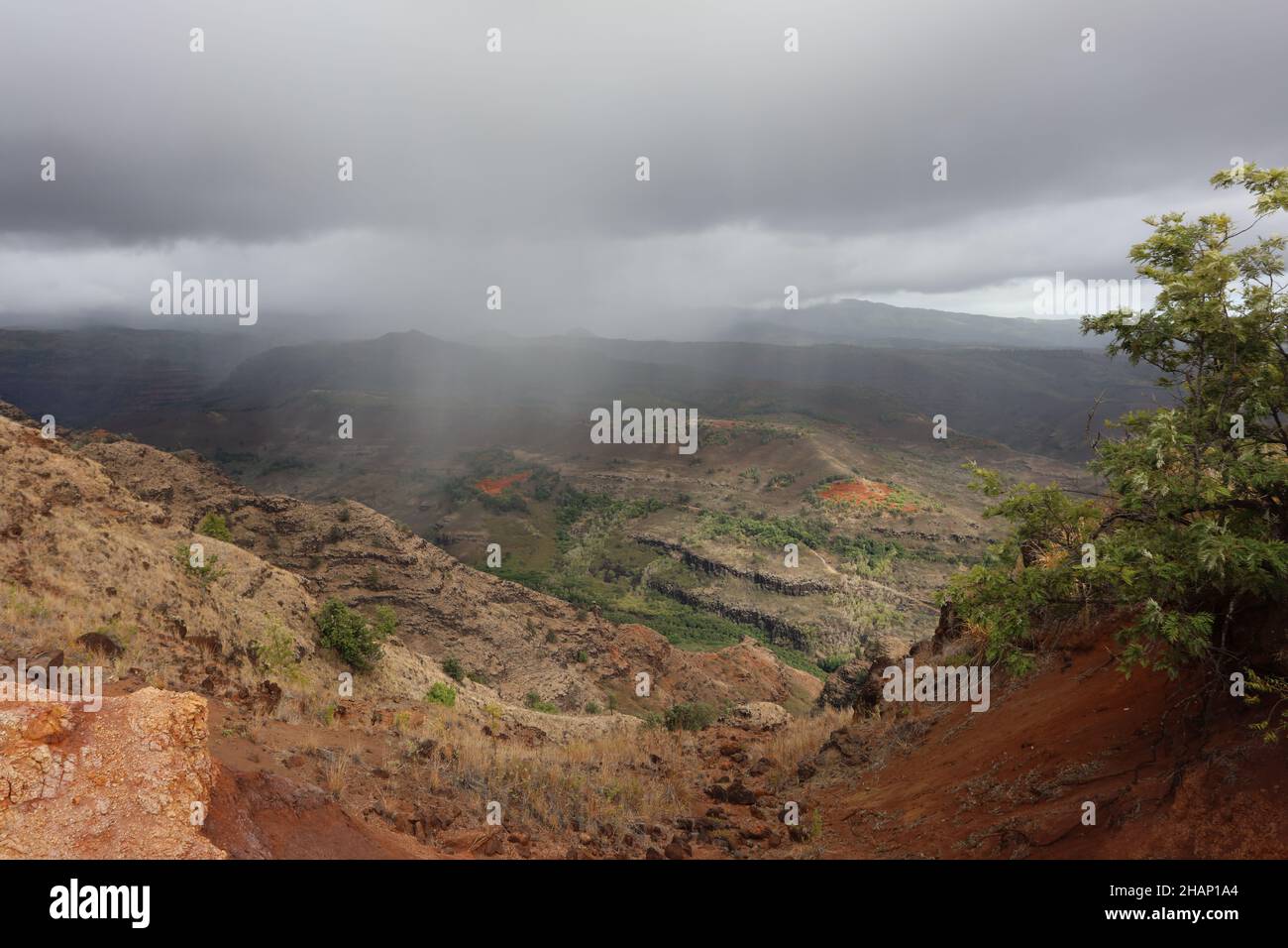 Rain falling down upon the small mountains and valleys on the outer ...