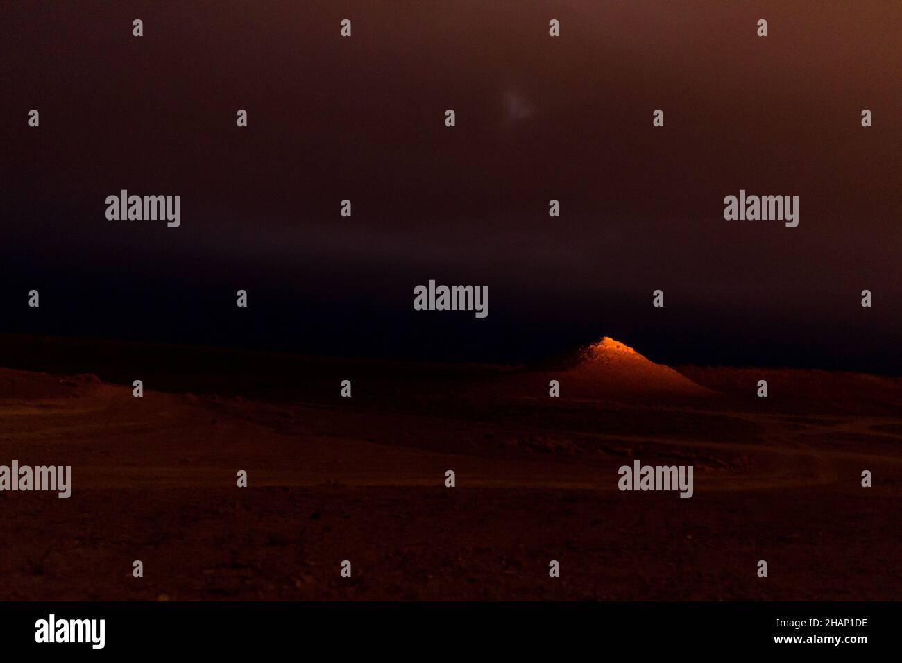 Peak illuminated by the light from Darvaza Derweze gas crater Door to ...