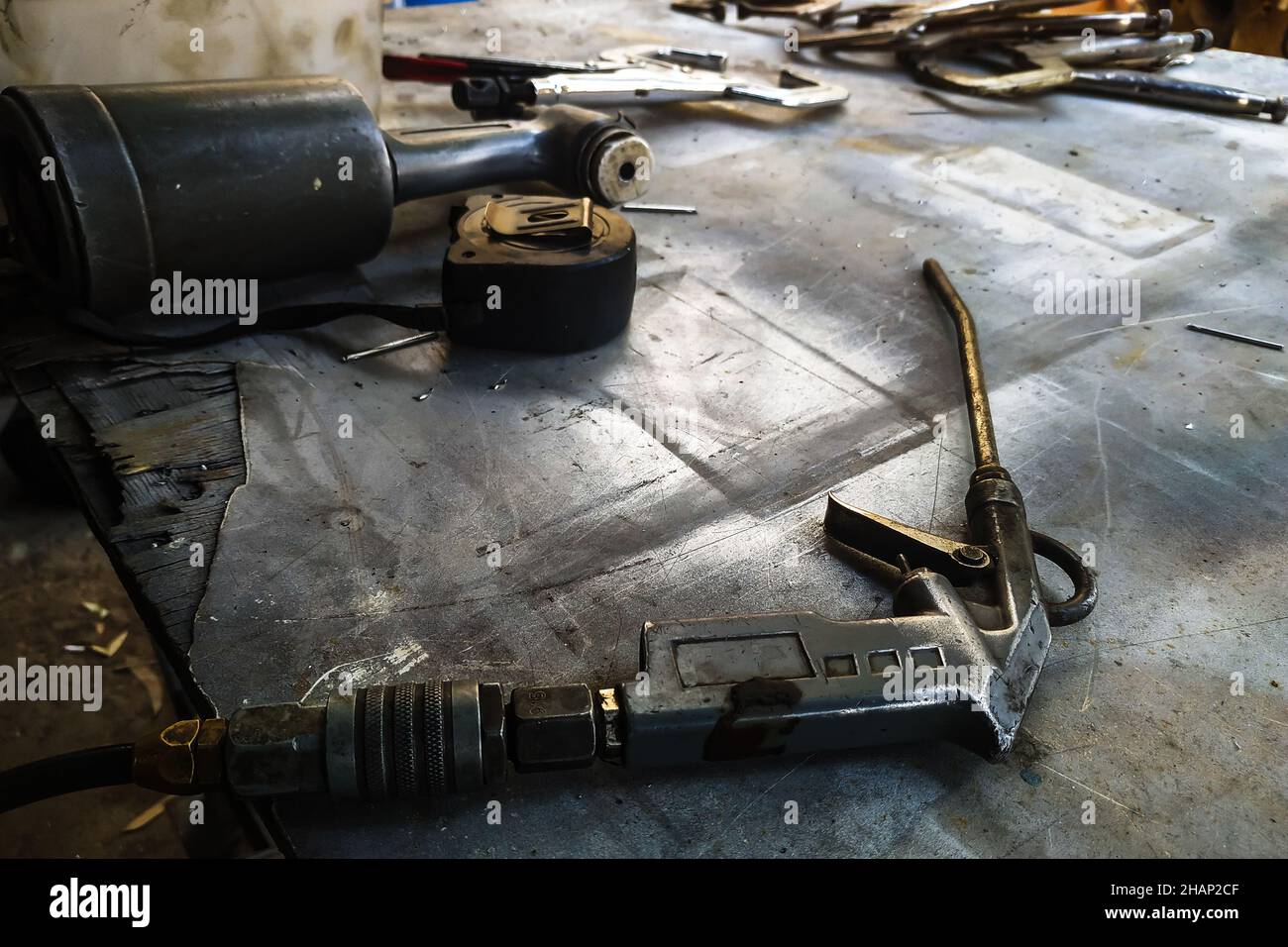 the workplace of a locksmith welder with different tools at the factory ...