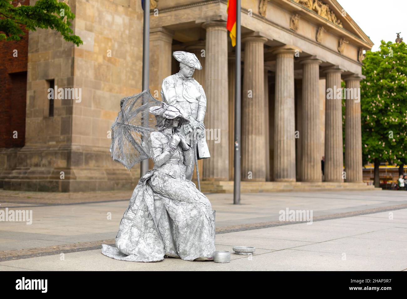 Art performance actors play statues on a city street. Berlin, Germany ...