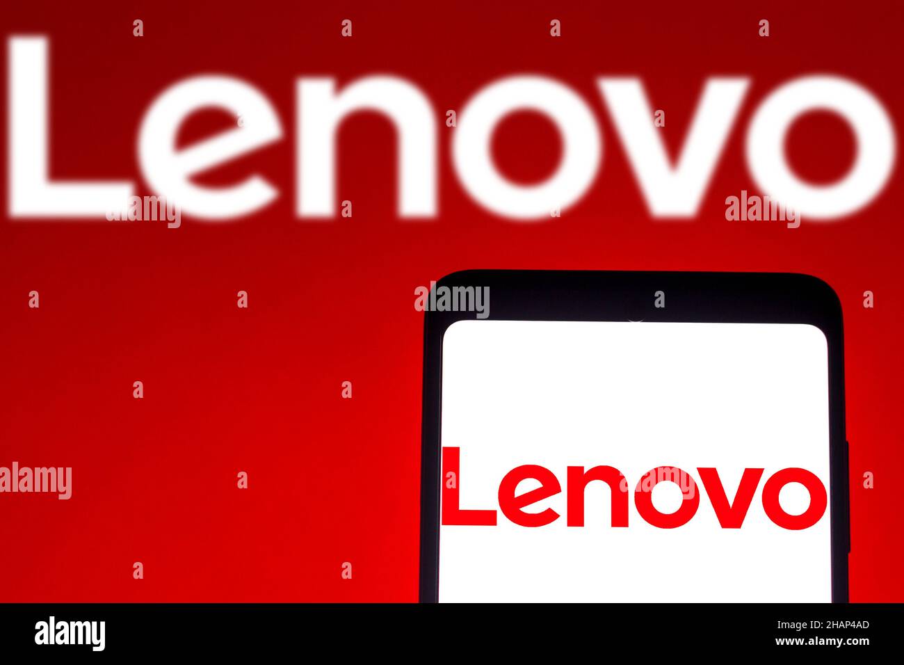 In this photo illustration, a Lenovo logo seen displayed on a ...