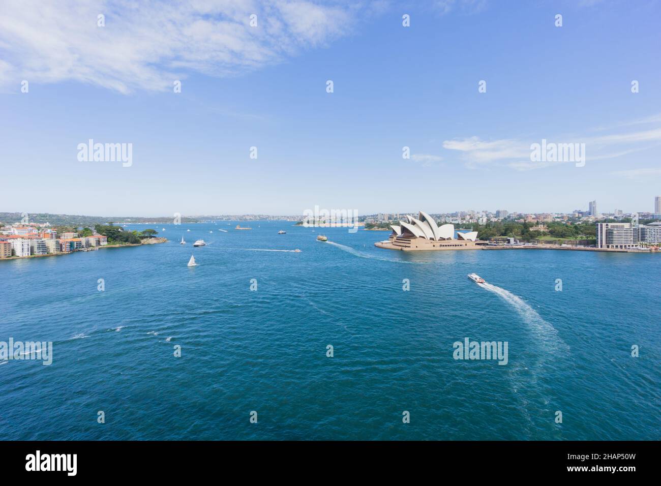 Sydney harbour and surrounds., beautiful blue water, white clouds ...