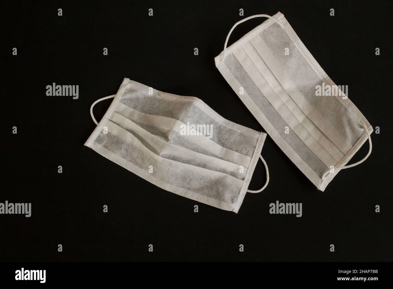 Top view of Medical,hygenic face mask on black background with copy ...