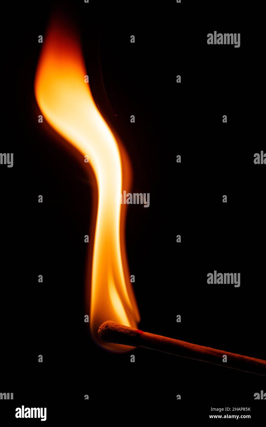 flame of a matchstick on black background Stock Photo - Alamy