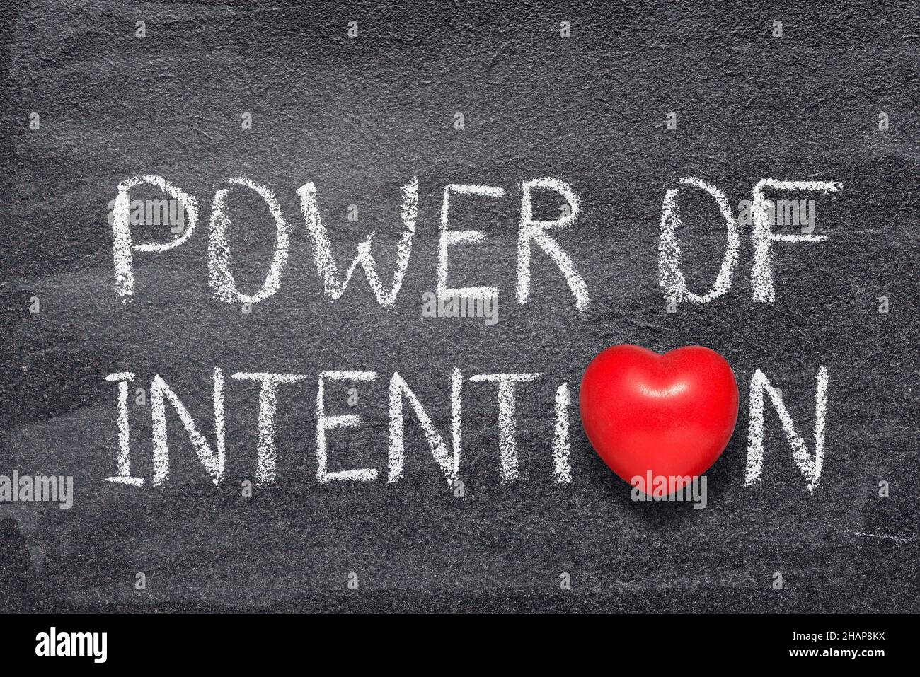 power of intention phrase written on chalkboard with red heart symbol ...