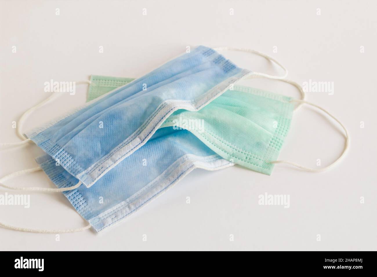 Three ply structure,single use hygenic face masks on white background ...