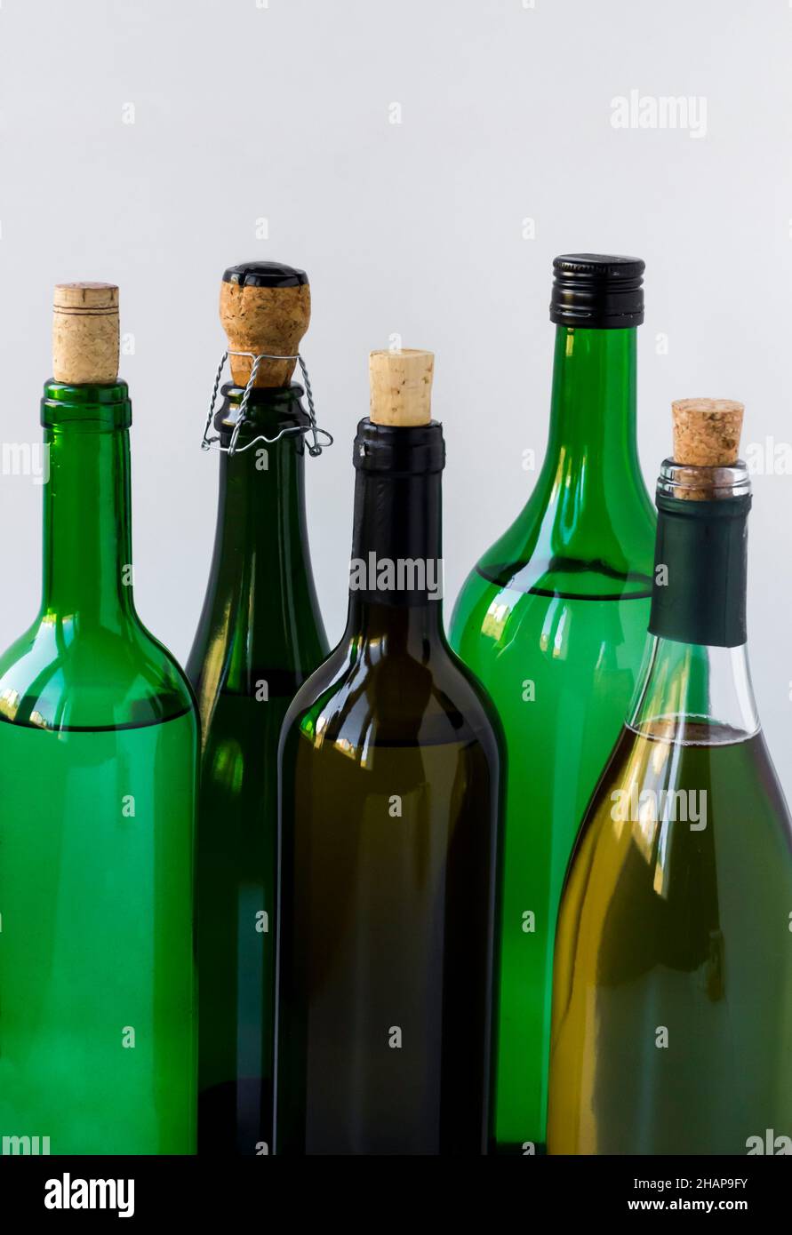 A group of alcoholic bottles on white surface,vertical images Stock ...