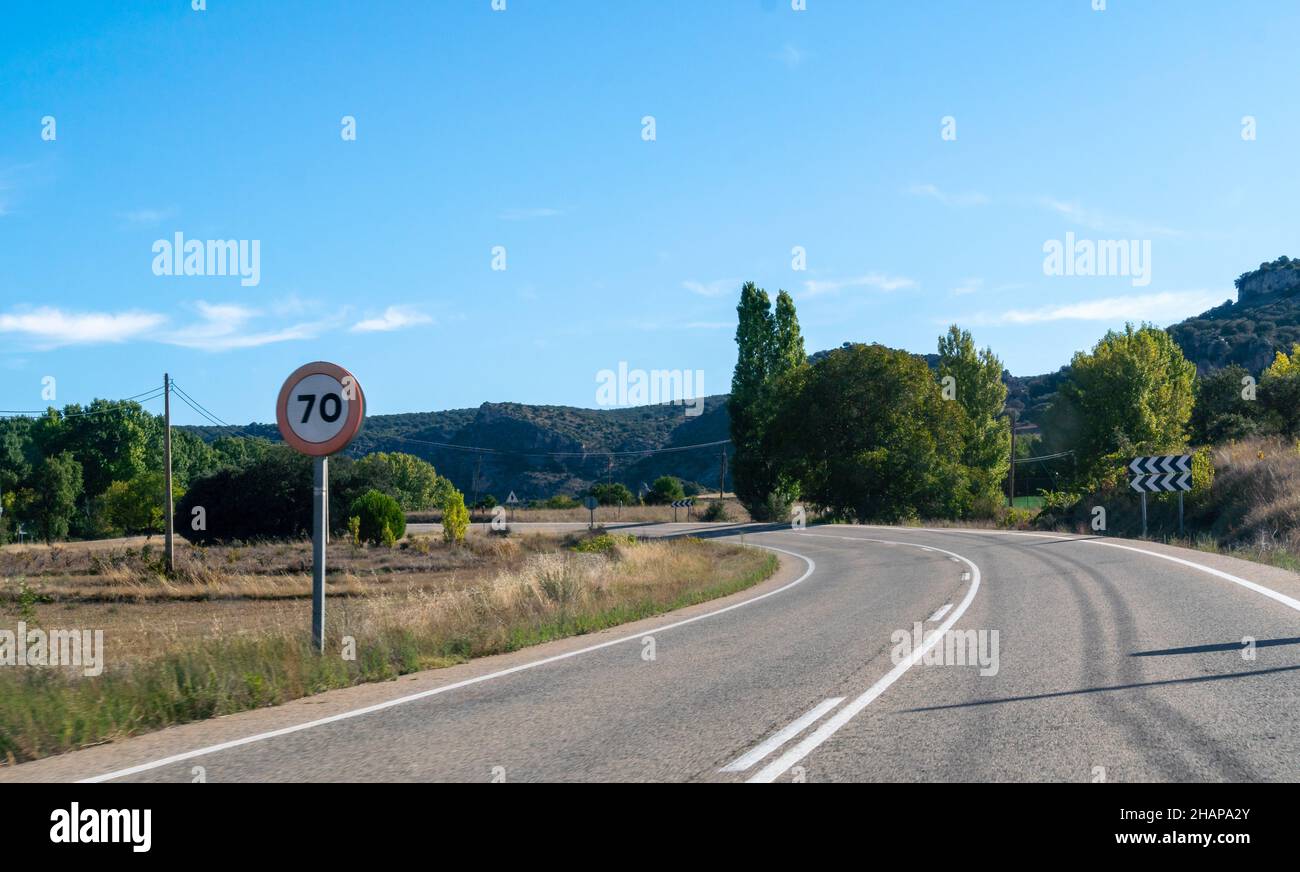 View of Two Direction Road in Spain With Speed Sign Stock Photo - Alamy