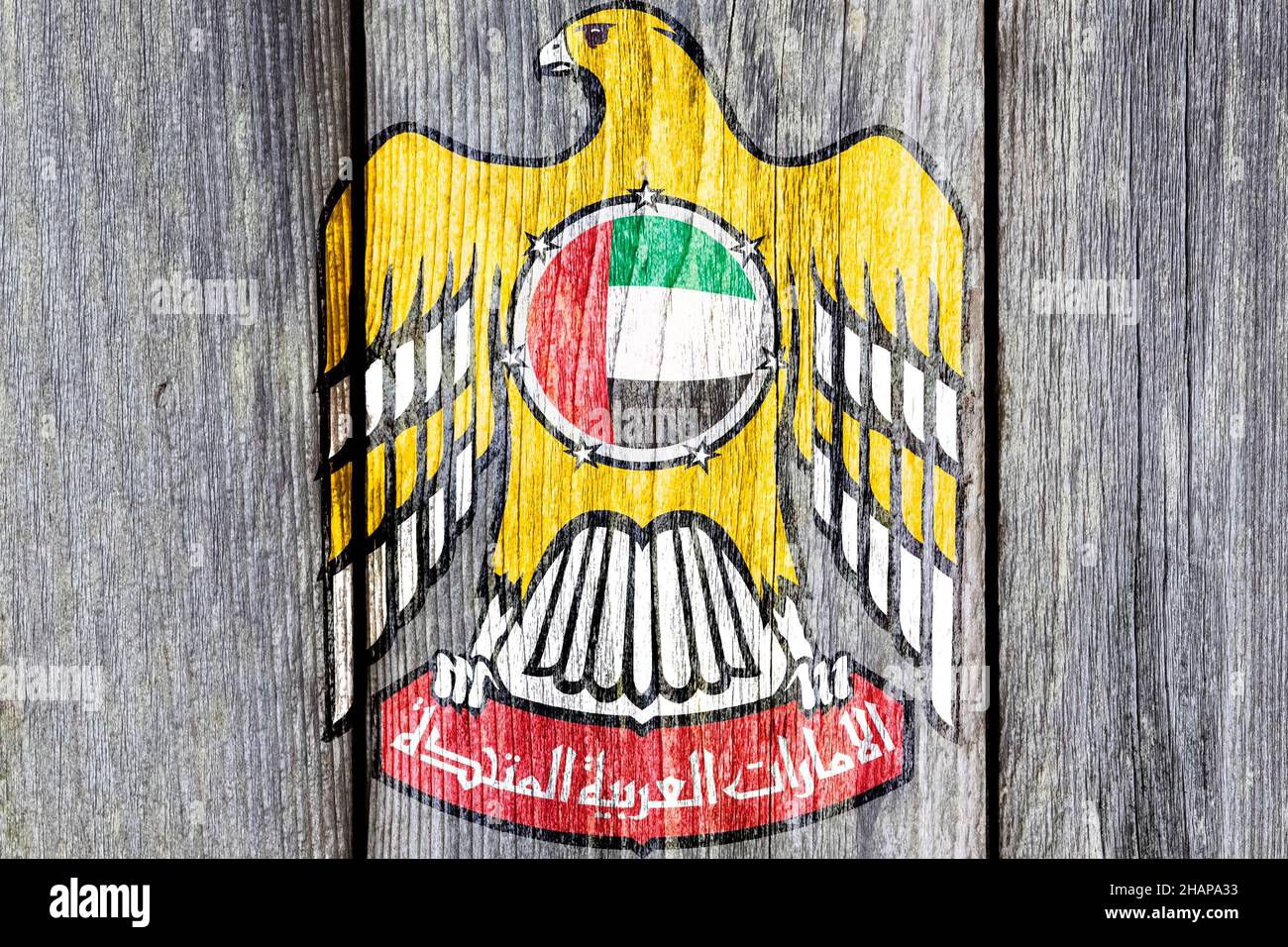 The Coat of Arms of UAE grunge pattern isolated on weathered wooden ...