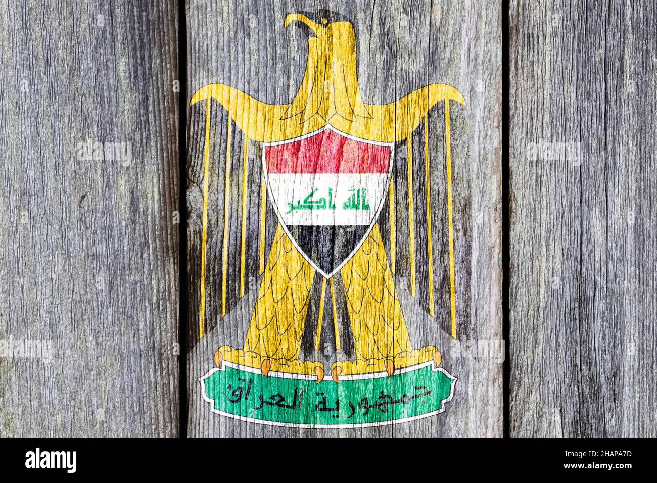 The Coat of Arms of Iraq grunge pattern isolated on weathered wooden ...