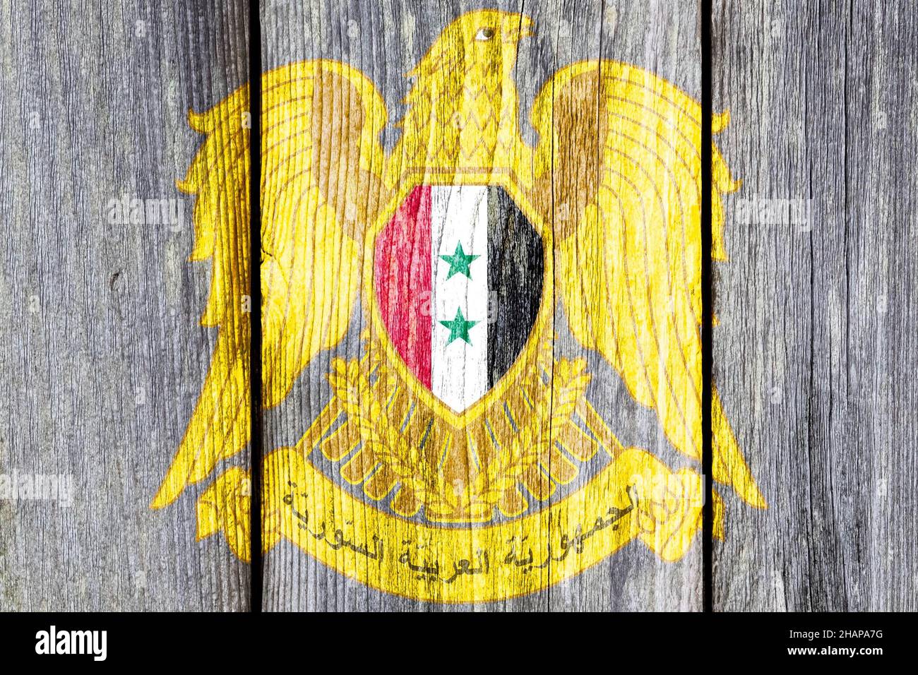 The Coat of Arms of Syria grunge pattern isolated on weathered wooden ...