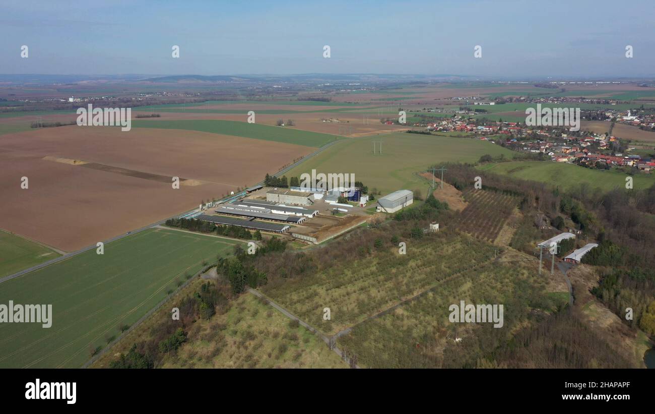 Dairy cows feeding barn dron aerial video shot, large fields farm field ...