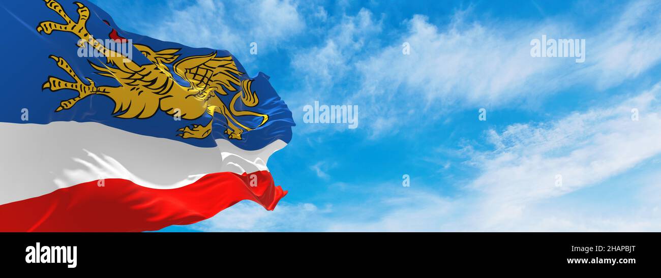 flag of Hansestadt Rostock at cloudy sky background on sunset ...