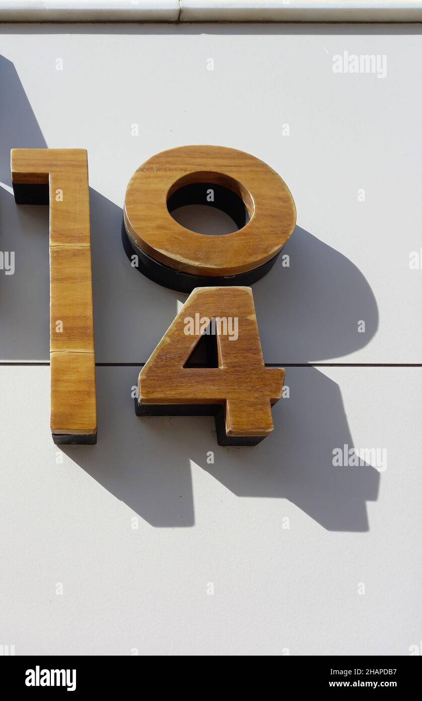 House number 104. Wooden white slate. Houses with personality concept ...