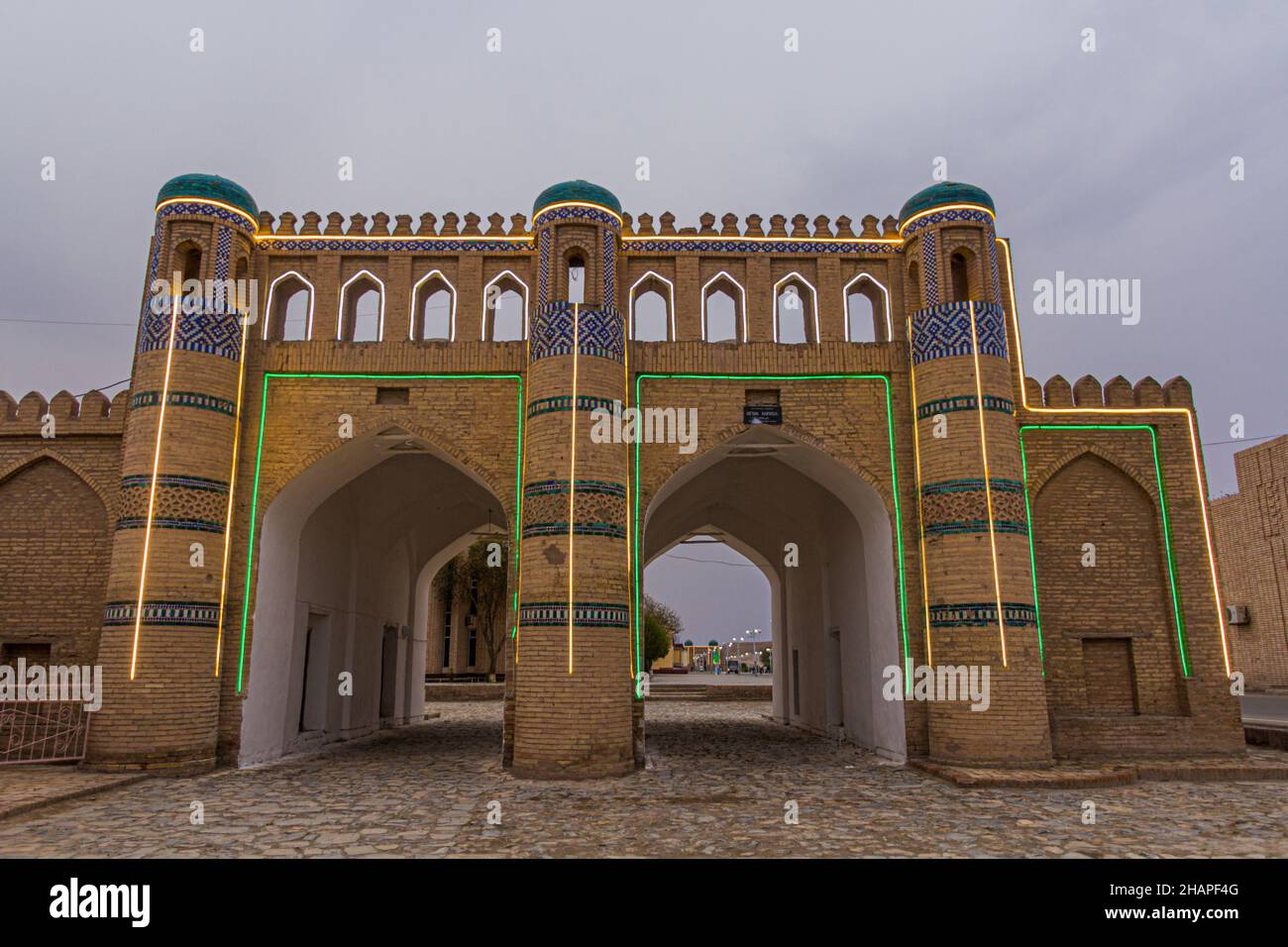 Illuminated ancient gate in Khiva, Uzbekistan Stock Photo - Alamy