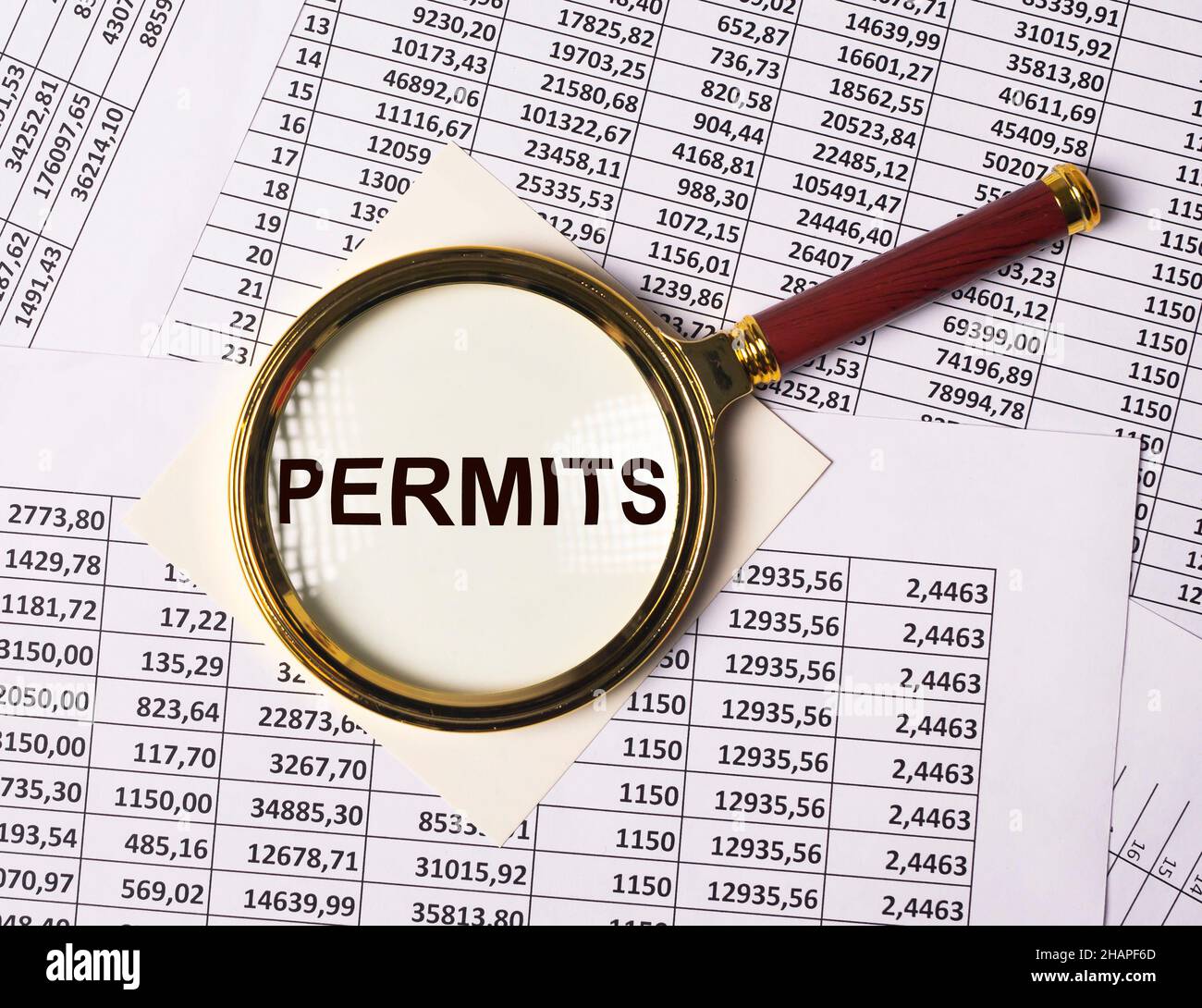 Permits word on business papers through magnifying glass. Permission ...