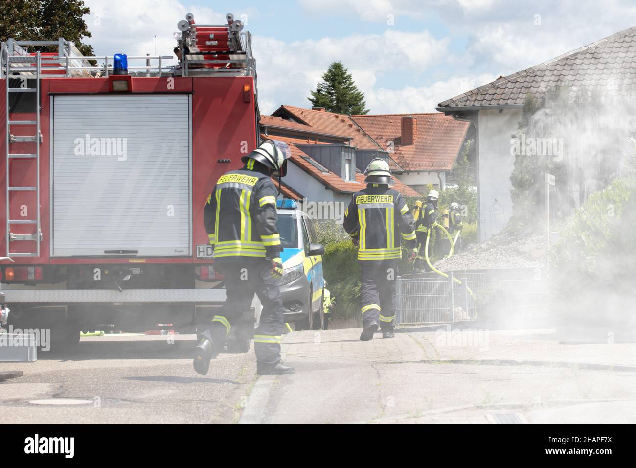 Closeup of German firefighters hard at work during daylight Stock Photo ...