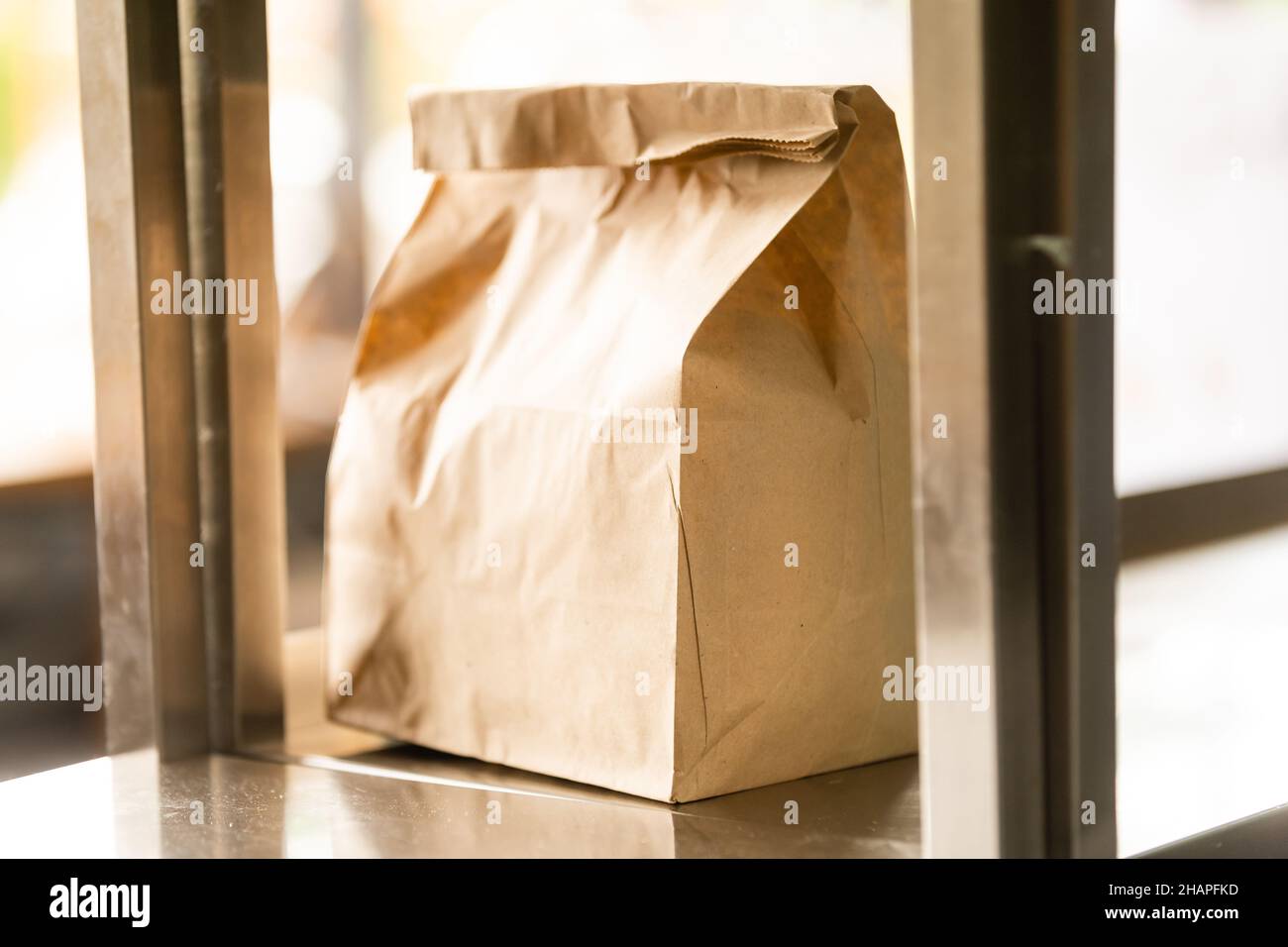 Brown clear empty blank paper bag for food delivery with copy space ...