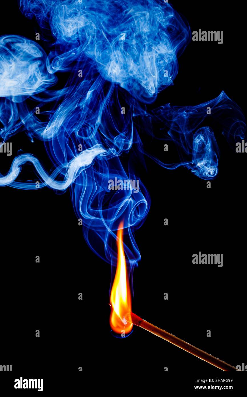flame and smoke of a matchstick on black background Stock Photo - Alamy