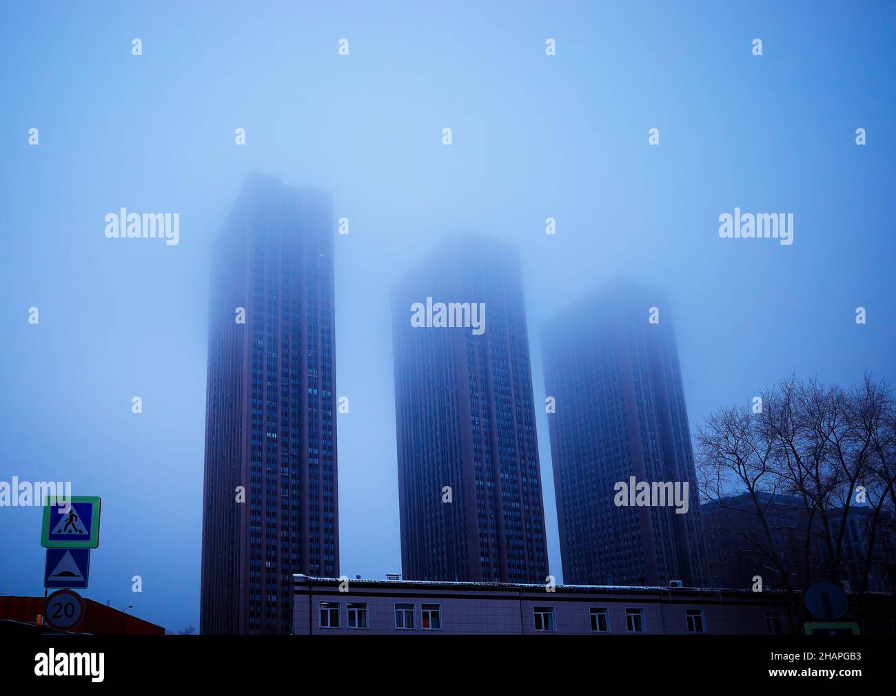 Multiple skyscrapers in fog scary architecture Stock Photo - Alamy