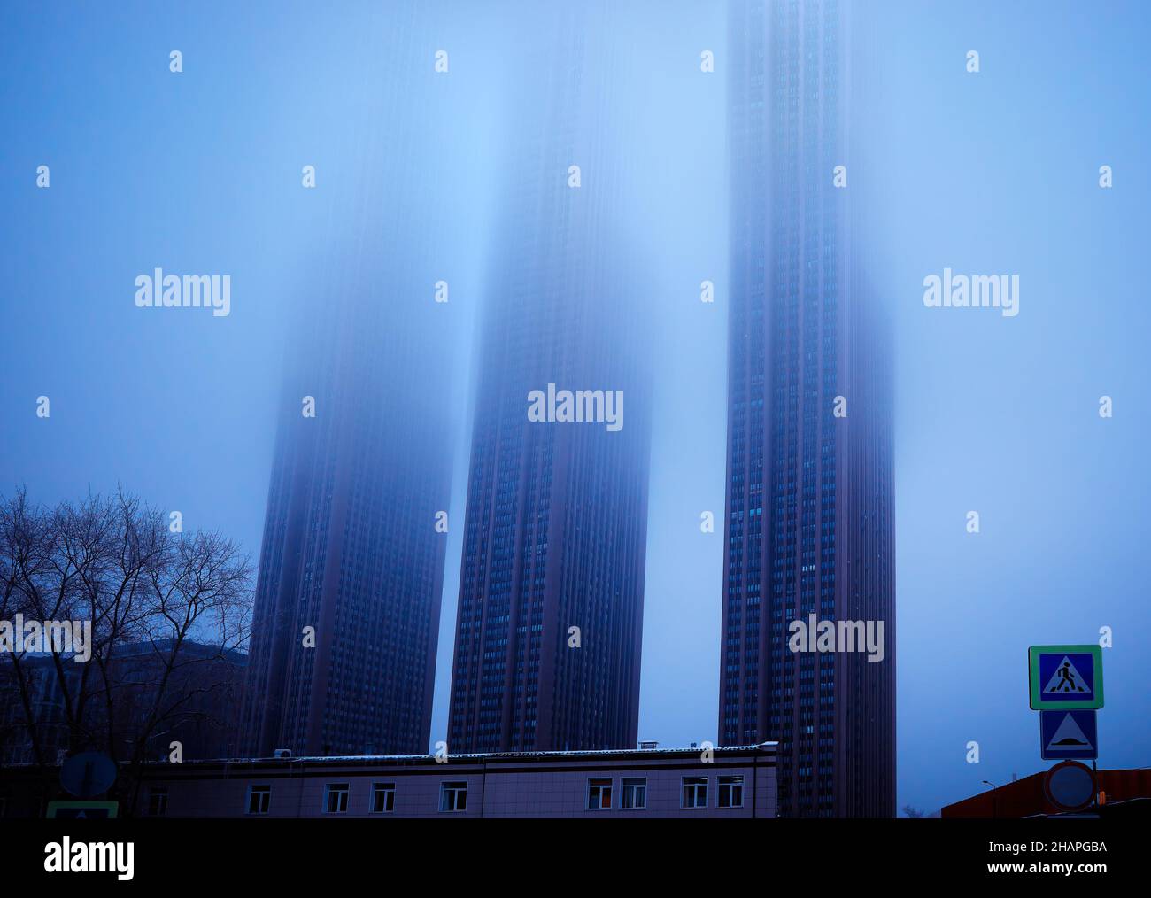 Multiple skyscrapers in fog scary architecture Stock Photo - Alamy
