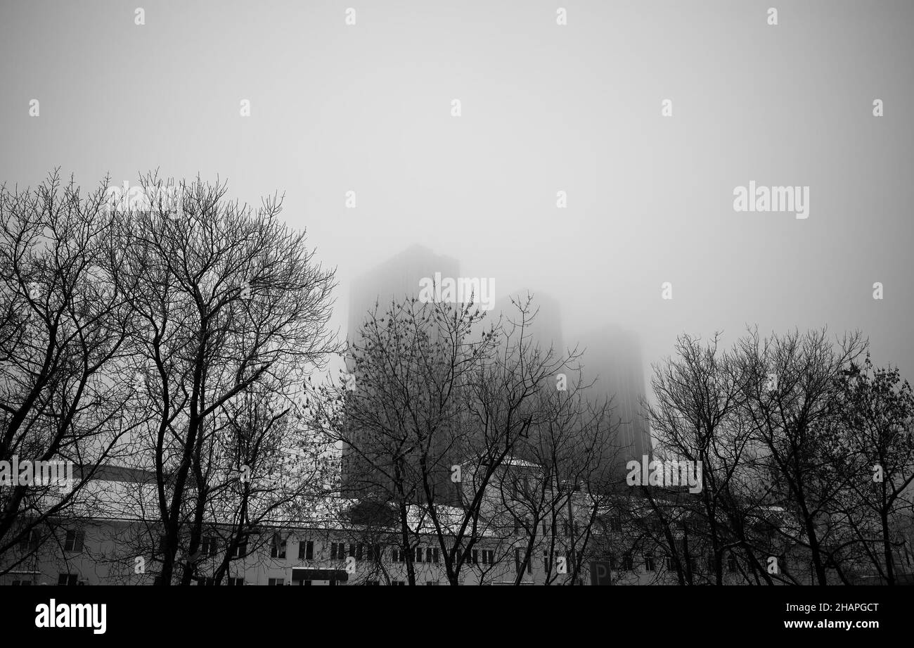 Multiple skyscrapers in fog scary architecture Stock Photo - Alamy
