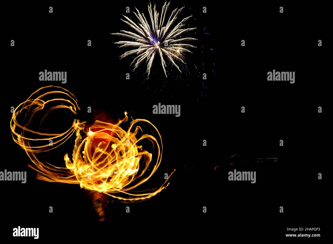 Digital render of abstract swirls and fireworks on a black background ...