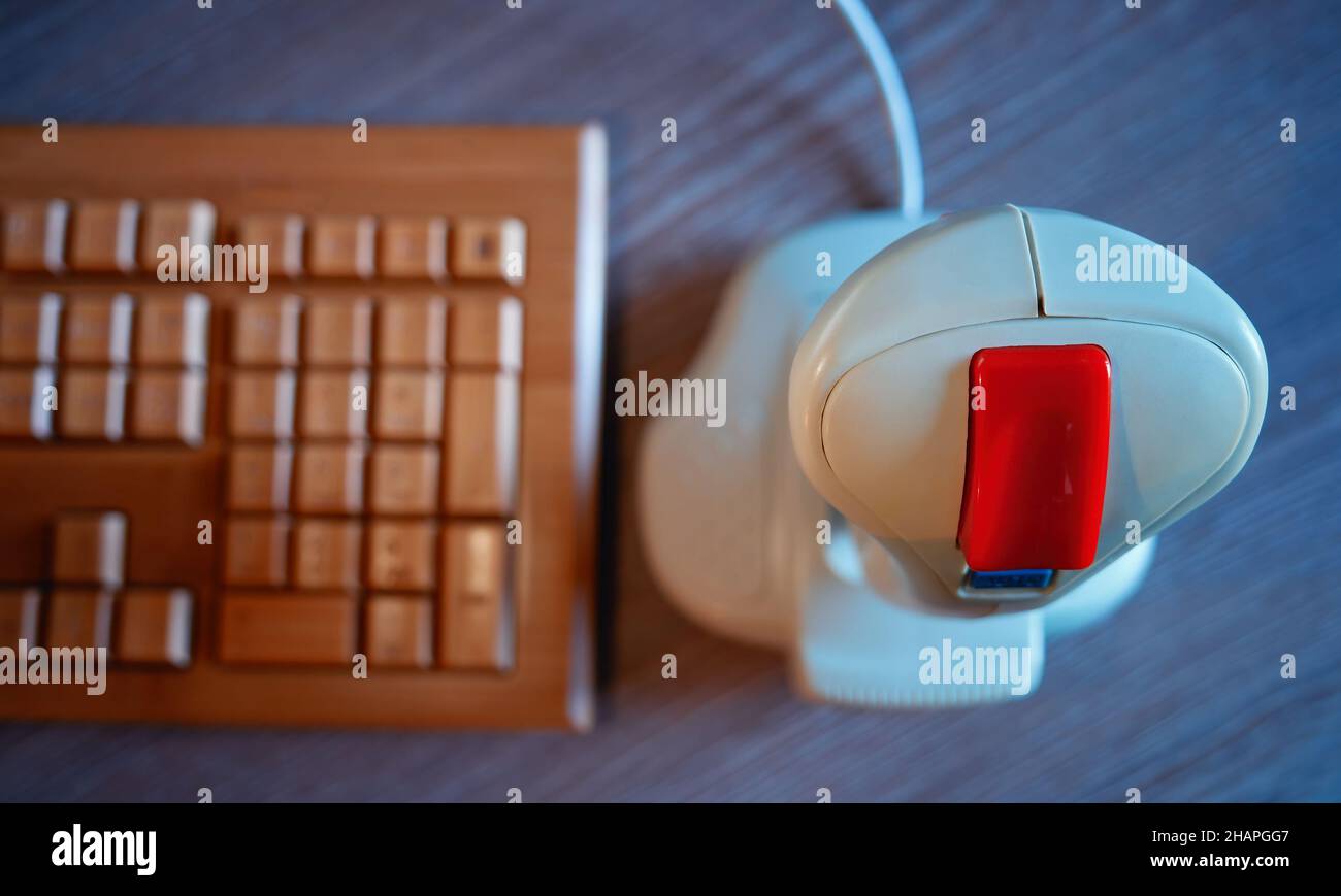 Vintage wooden keyboard with red joystick background Stock Photo - Alamy