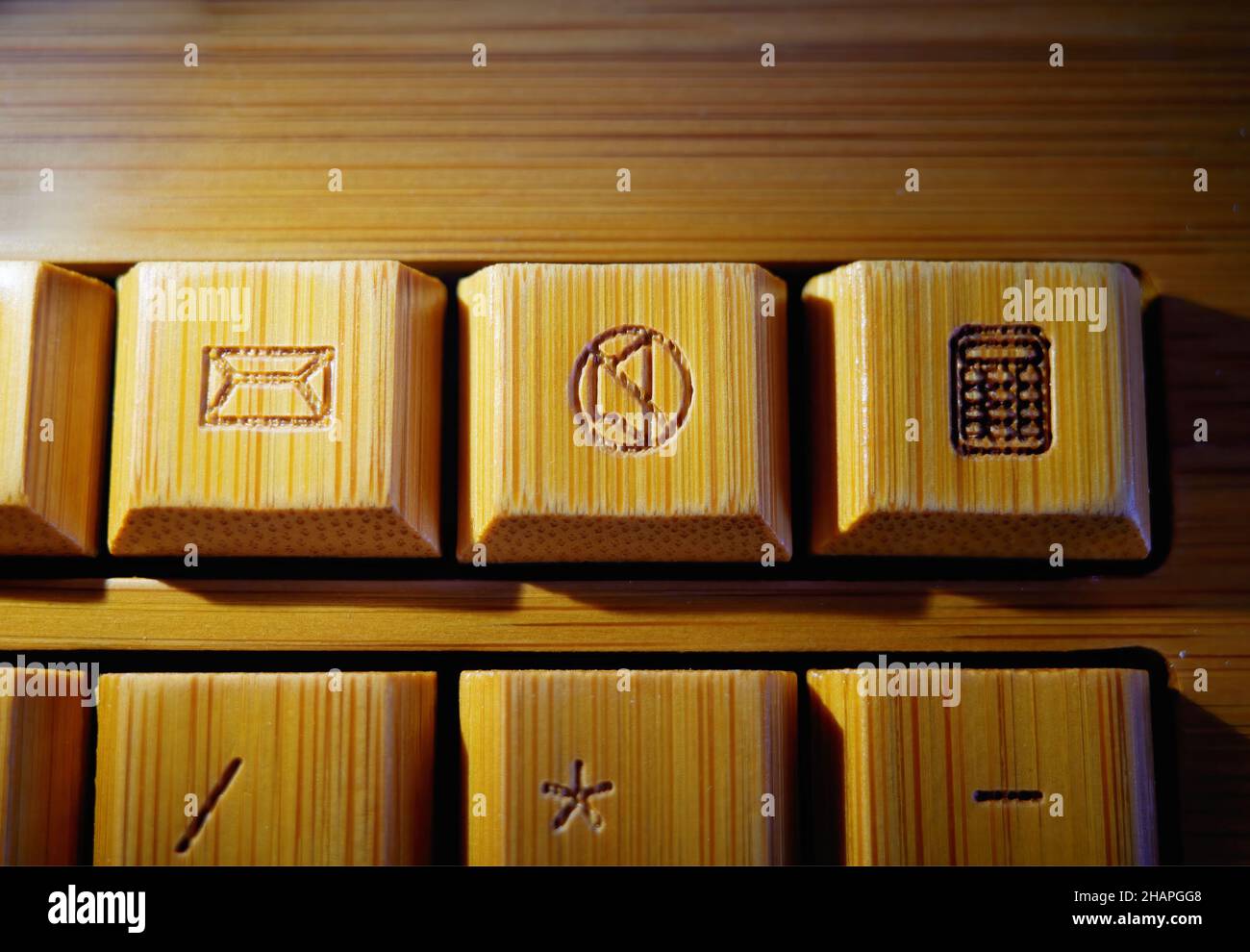 Multimedia keys on wooden keyboard backdrop Stock Photo - Alamy