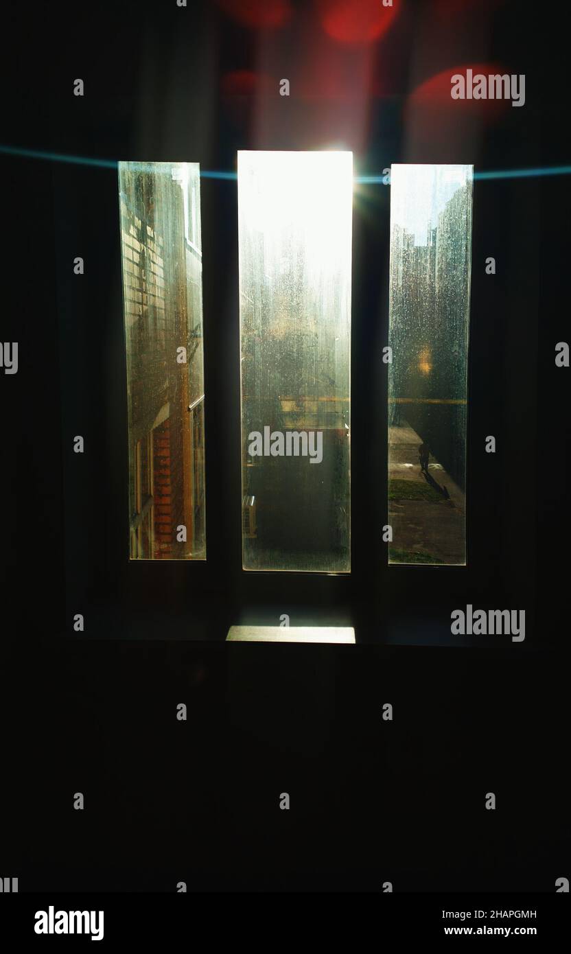 Three vertical windows light leak backdrop Stock Photo - Alamy