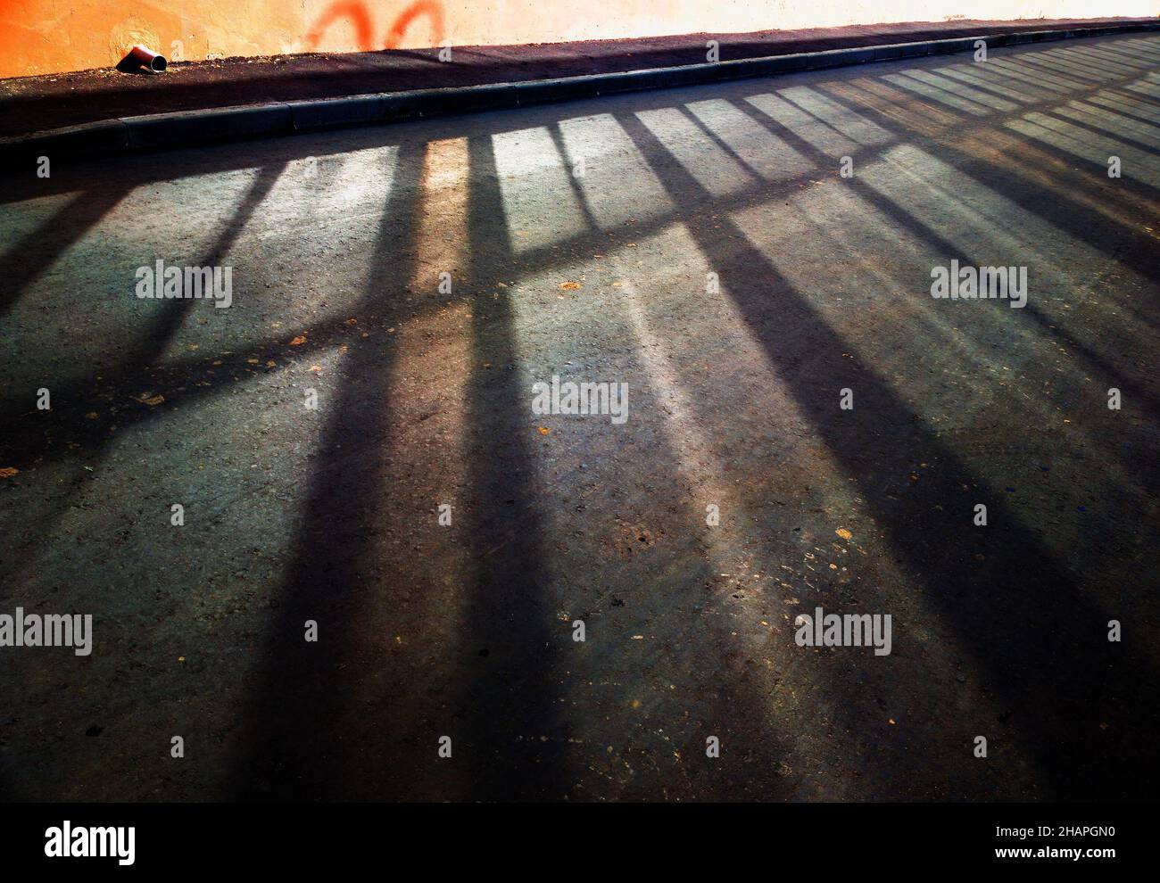 Dramatic light beams on street asphalt background Stock Photo - Alamy