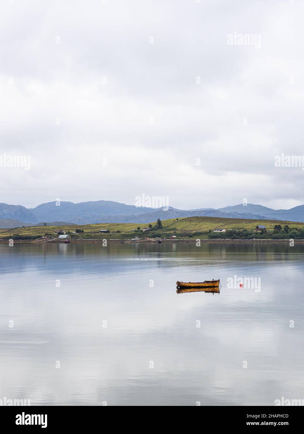 Wooden hull boat lying at anchor on Loch Ewe, Wester Ross, Ross-shire ...