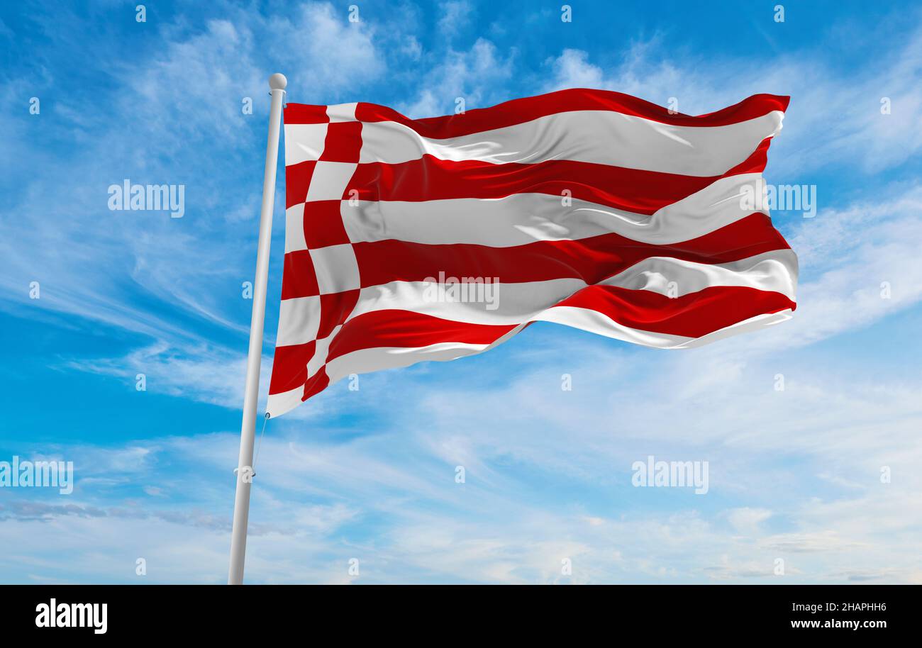 flag of Bremen at cloudy sky background on sunset, panoramic view ...