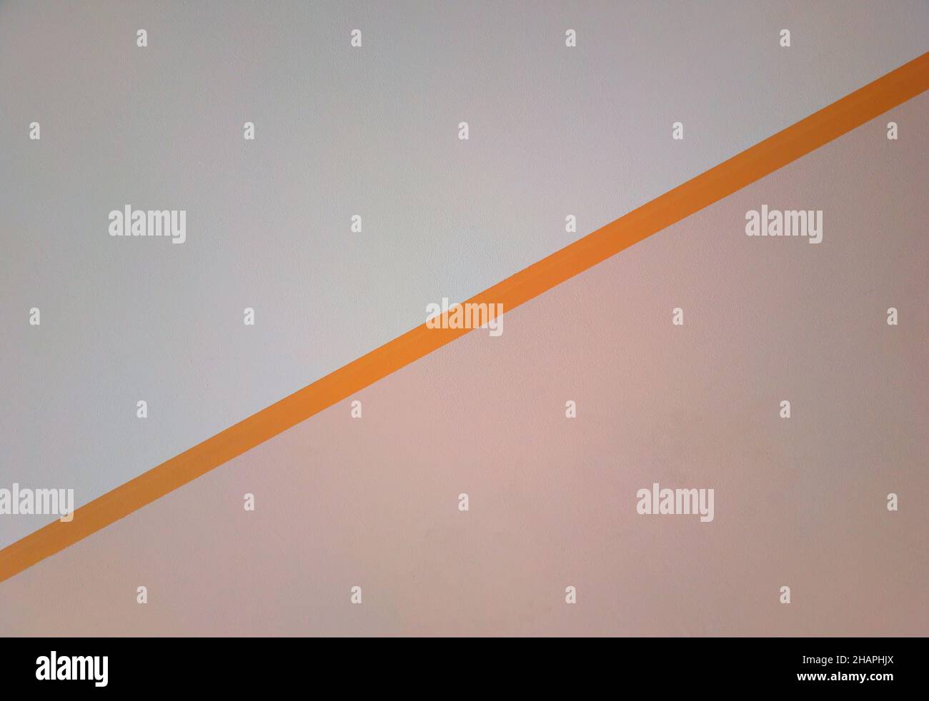Diagonal orange line on wall texture backdrop Stock Photo - Alamy