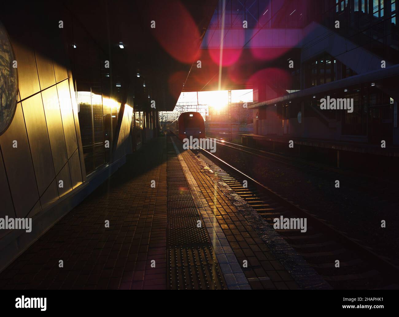 Arriving train at railroad station transportation Stock Photo - Alamy
