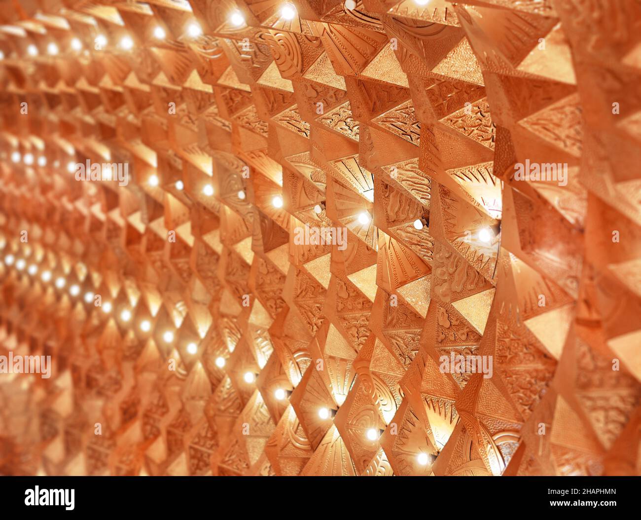 Golden lamps abstract wall background Stock Photo - Alamy