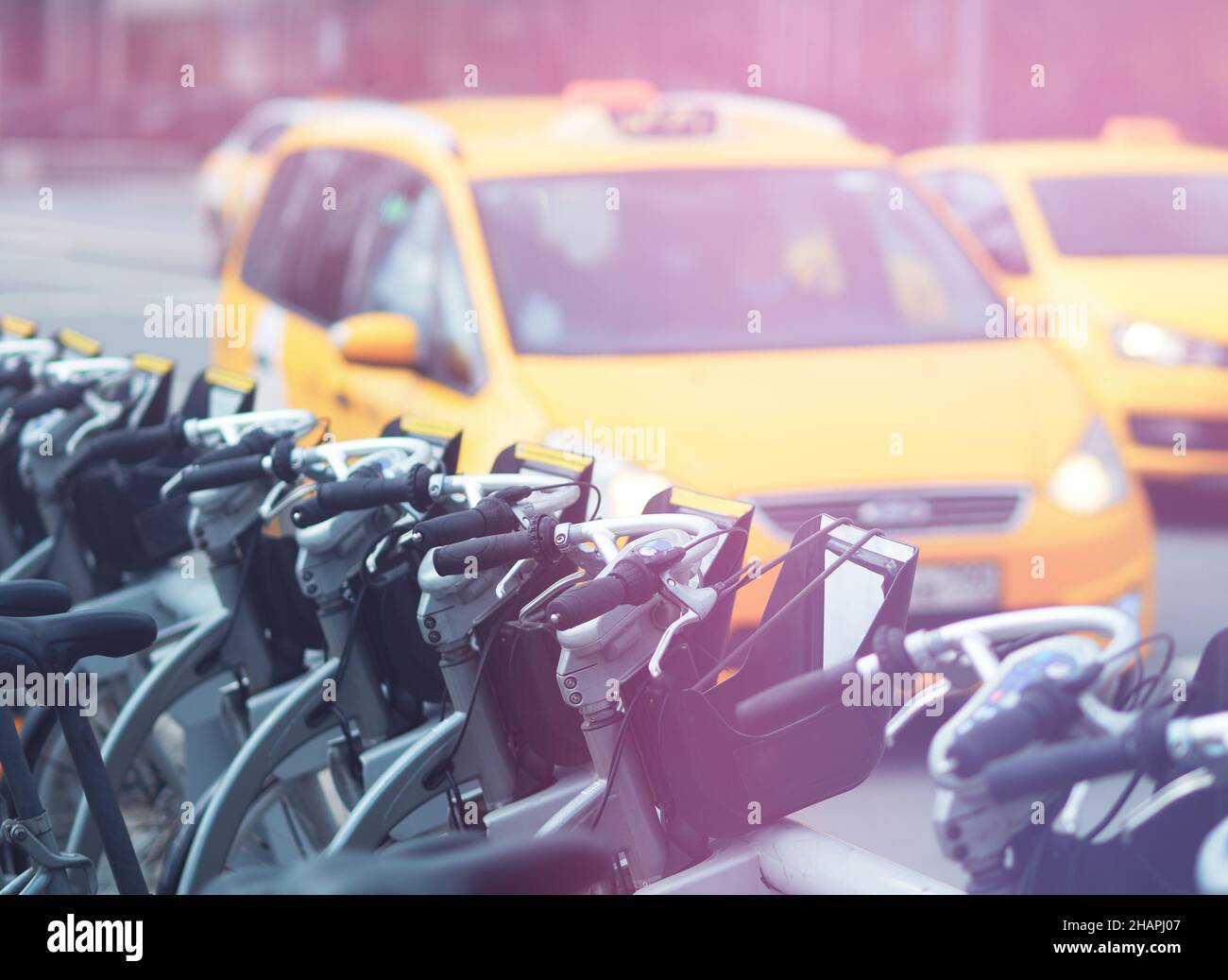 Bicycle vs taxi parking transportation backdrop Stock Photo - Alamy