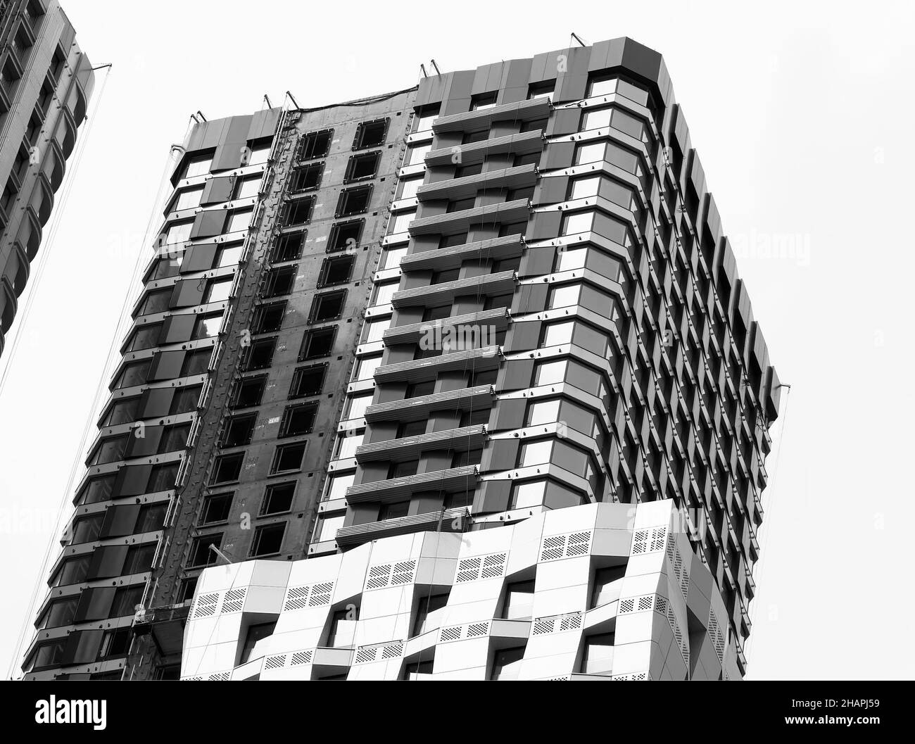 Diagonal skyscraper under construction background Stock Photo - Alamy
