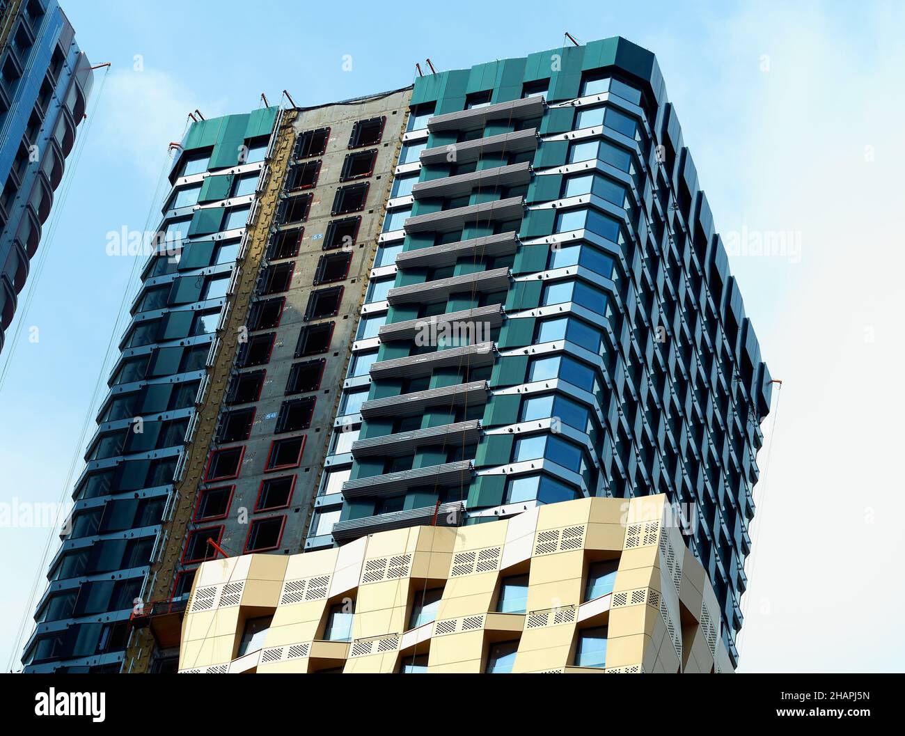 Diagonal skyscraper under construction background Stock Photo - Alamy